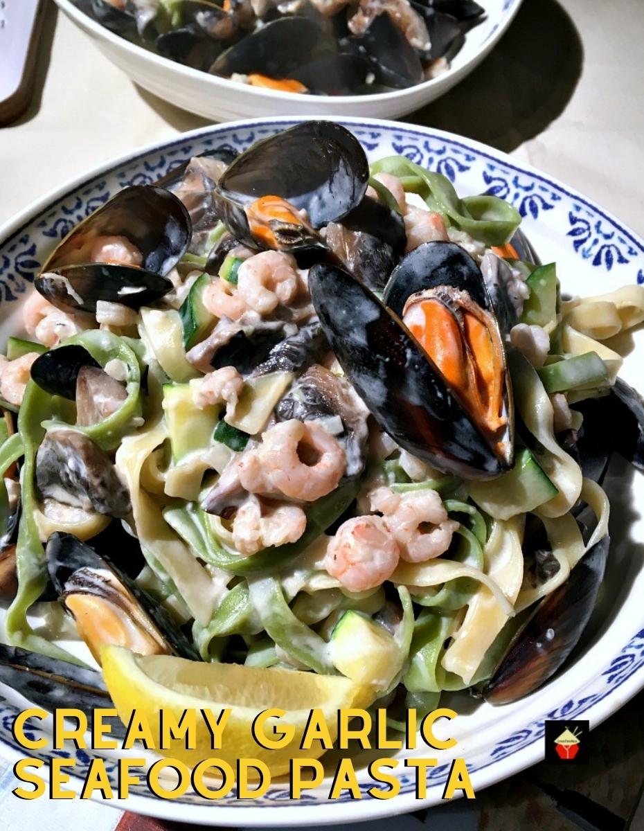 Creamy Garlic Seafood Pasta, with a delicious creamy white wine sauce.